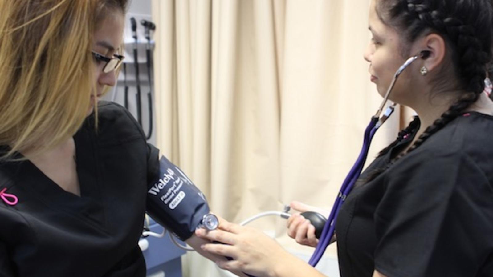 Melrose Park Medical Assistant Taking Blood Pressure Readings Melrose Park Medical Assistant Taking Blood Pressure Readings